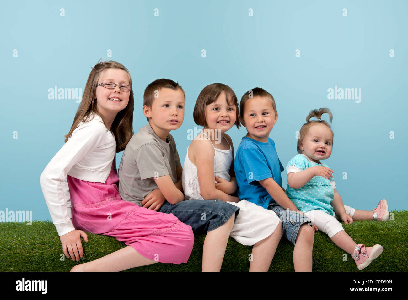 happy children in a row Stock Photo - Alamy
