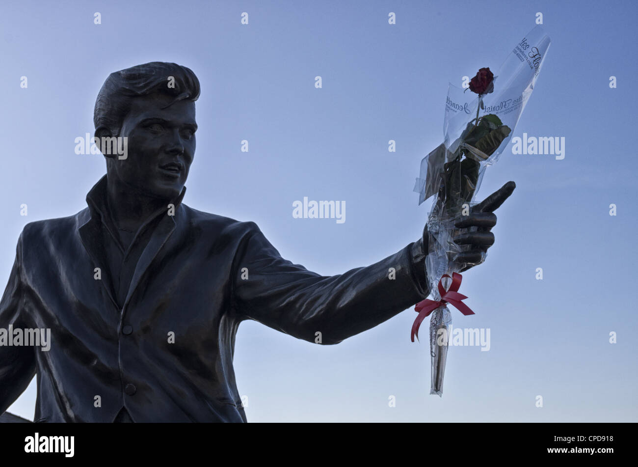 Bronze sculpture by Tony Murphy 2003 of Billy Fury carrying red rose ...