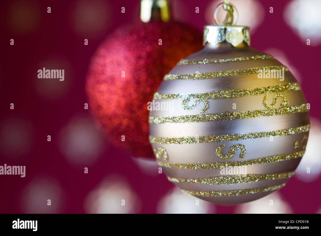 Christmas ball pending with a snow effect background (selective and ...