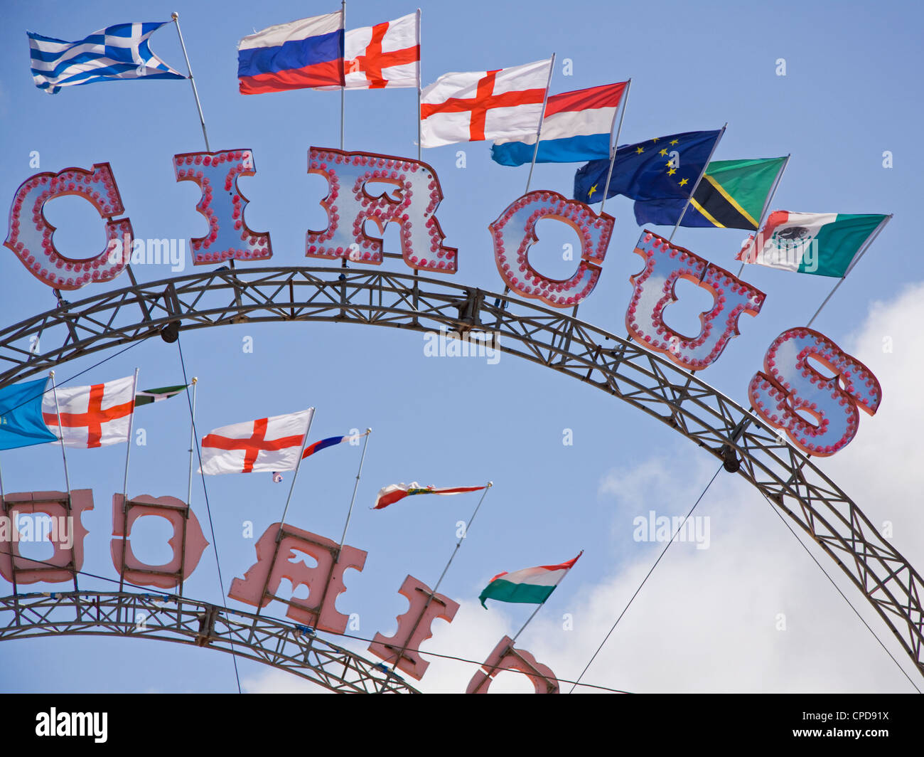 The flags of various nationalities flying from the top a circus Big Top ...