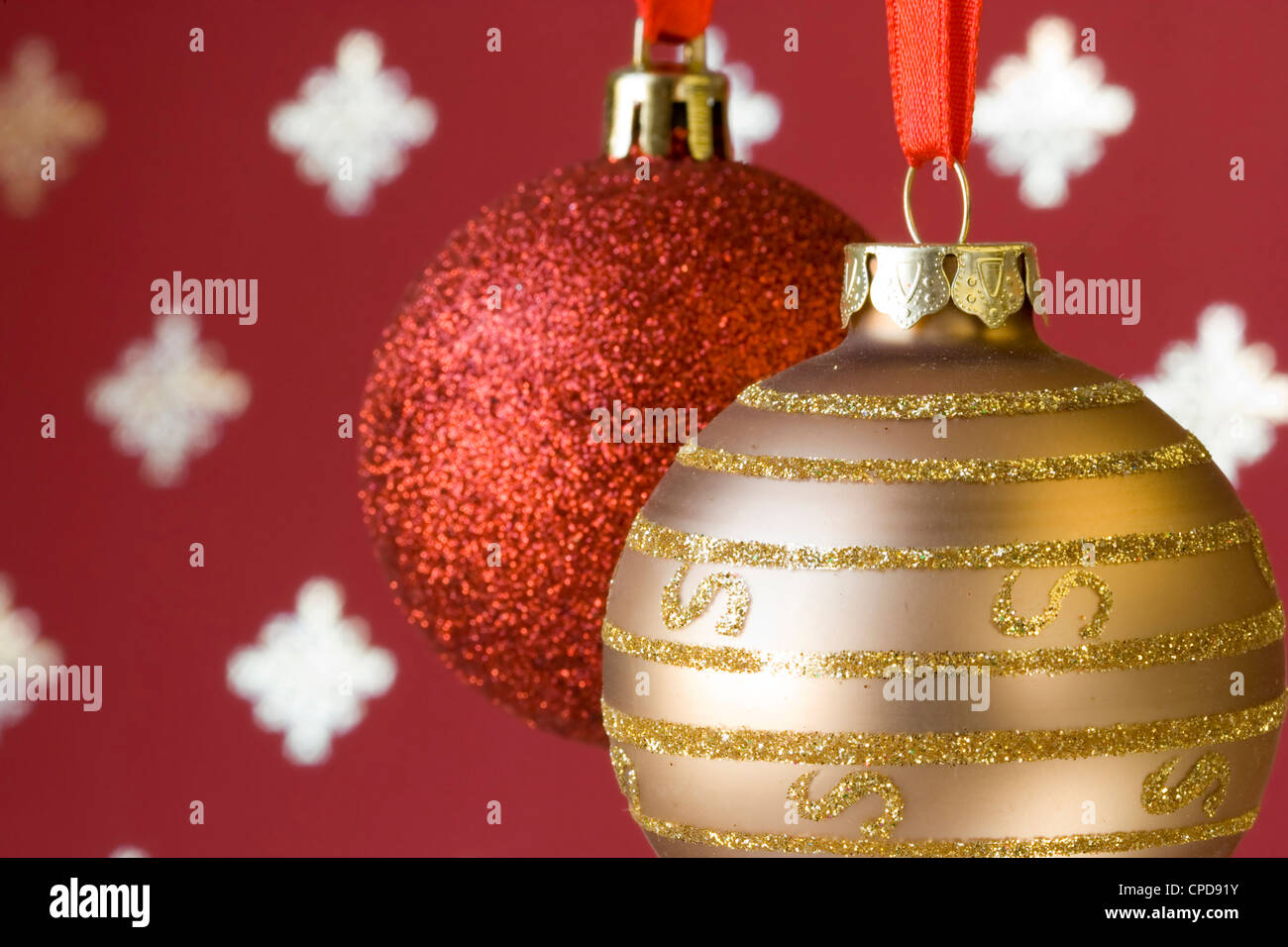 Christmas ball pending with a snow effect background (selective and ...