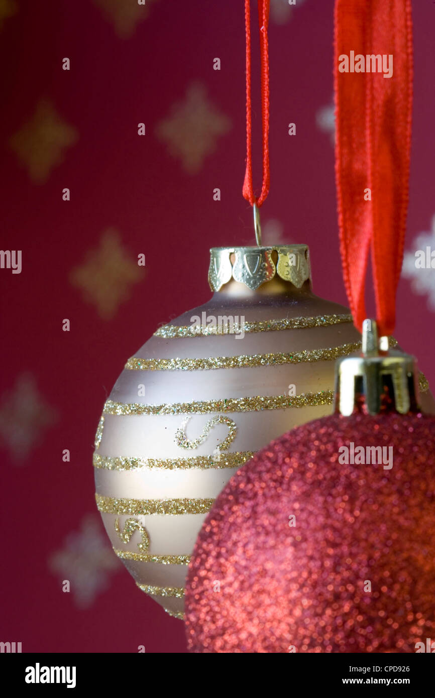 Christmas ball pending with a snow effect background (selective and ...