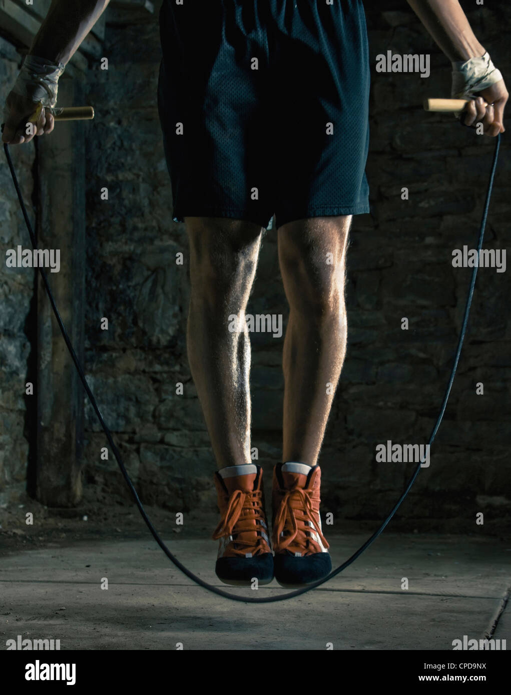 Caucasian boxer training and jumping rope Stock Photo - Alamy