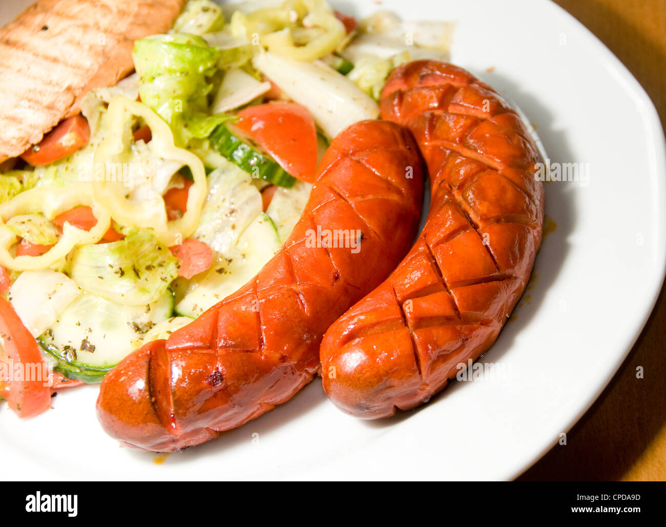 debrecziner spicy Hungarian sausage with salad as photographed in ...