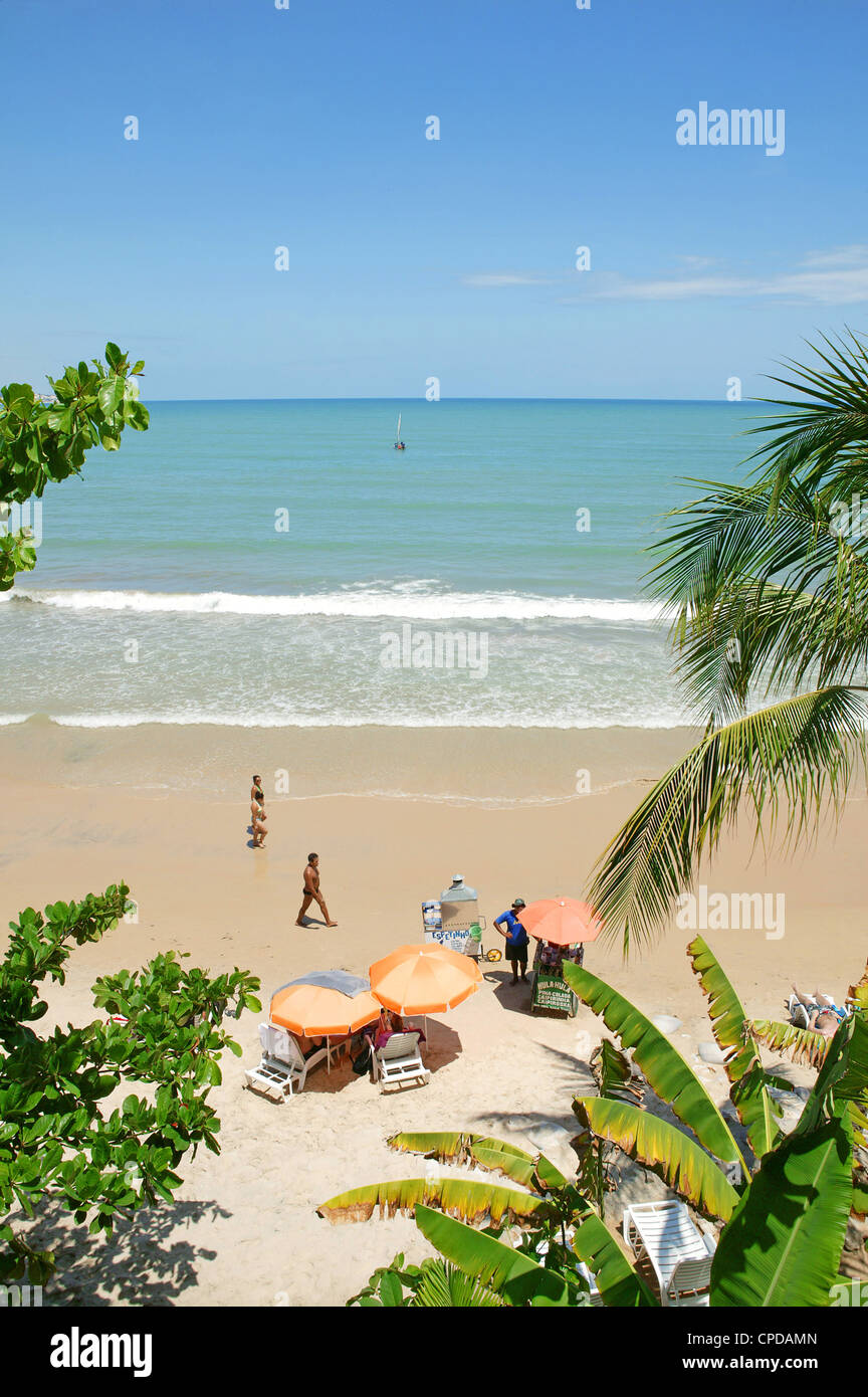 Brazil Natal people chairs and yellow parasol on beach sunny day with ...