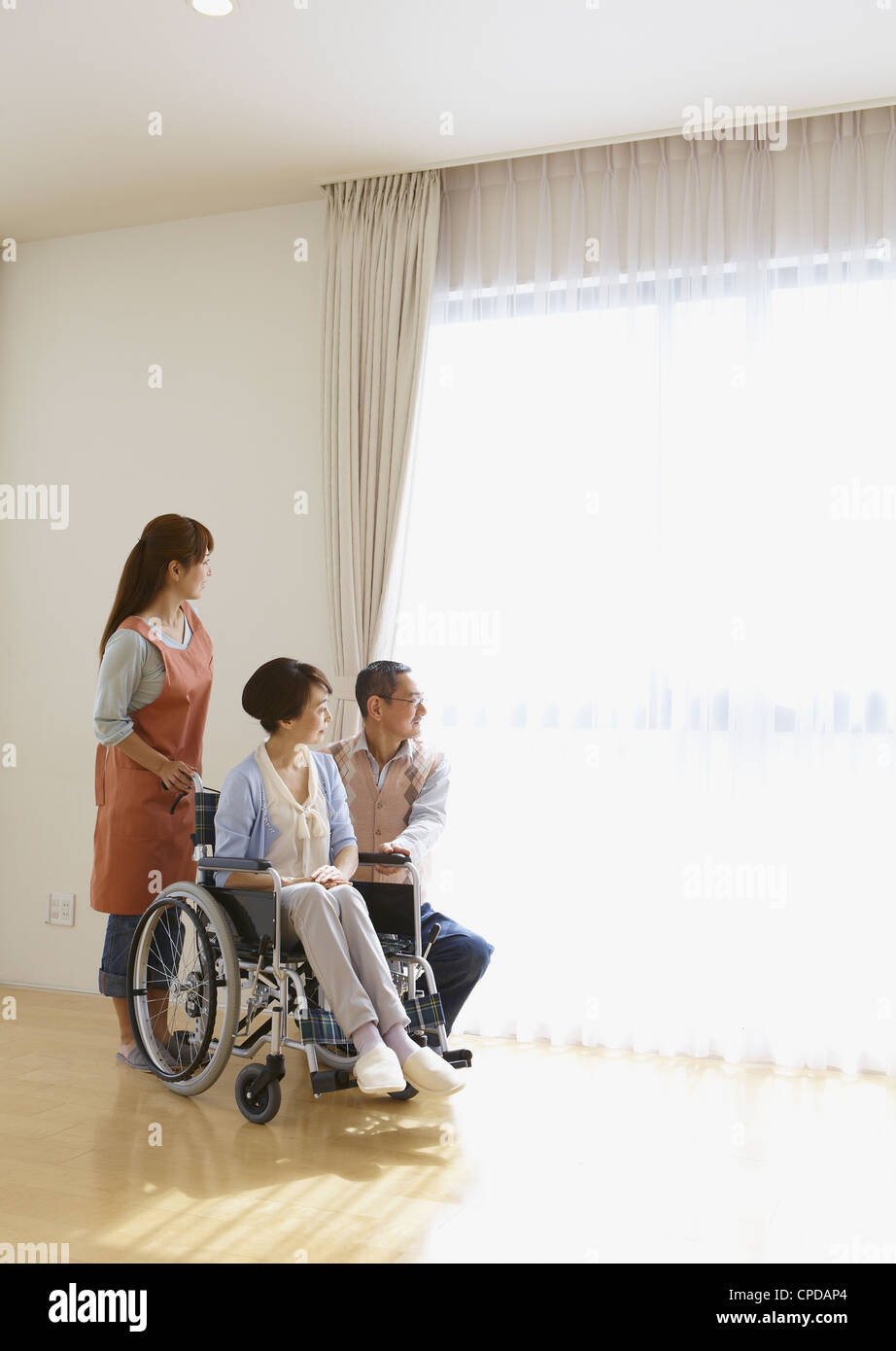 Home helper and senior couple Stock Photo - Alamy