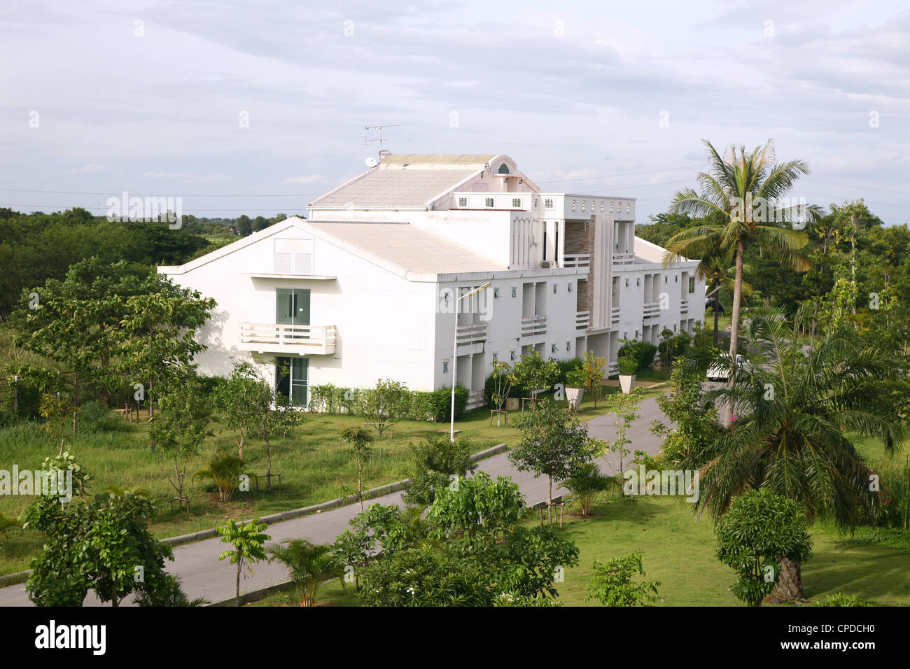 white factory house and tree Stock Photo - Alamy