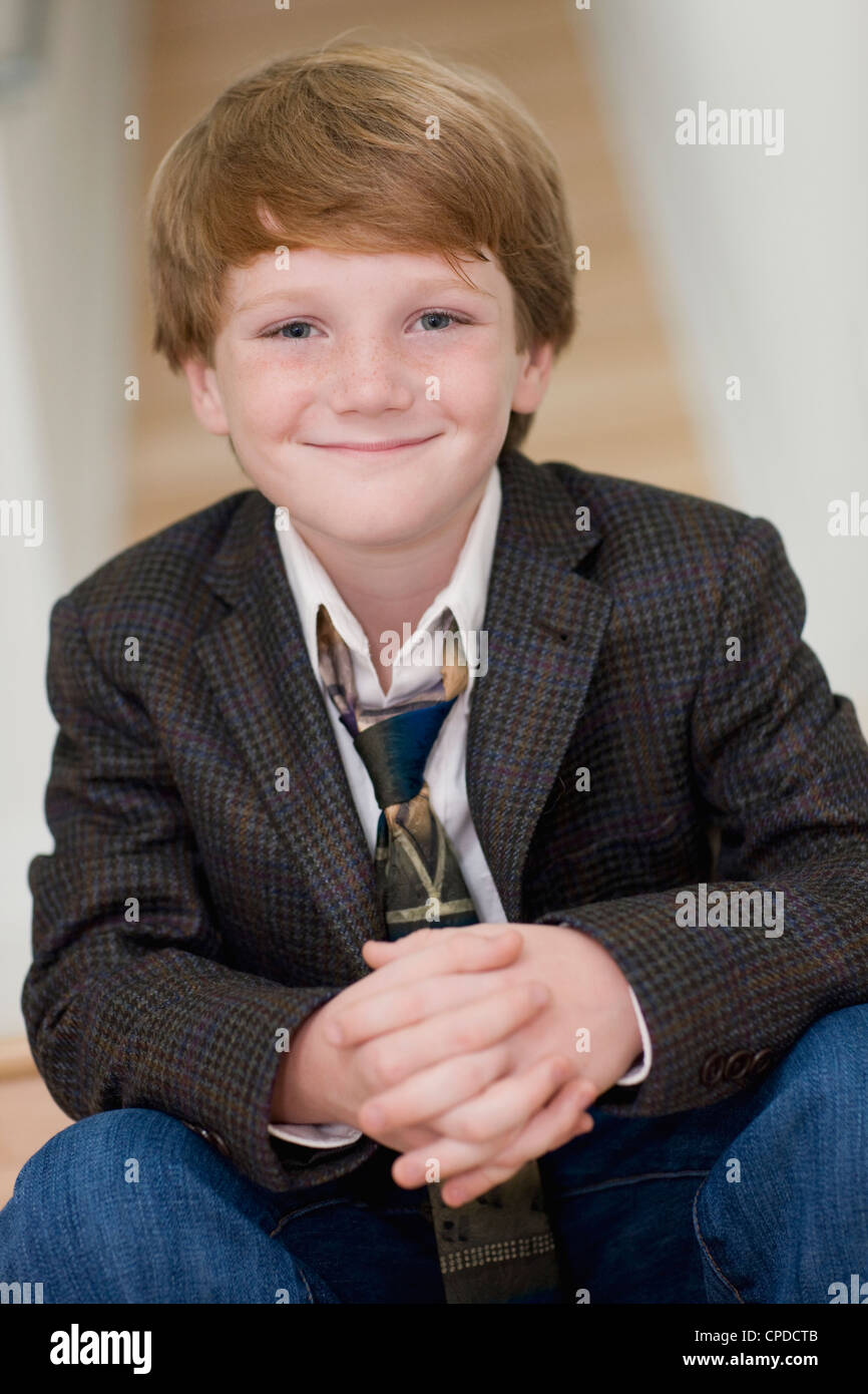Smiling Caucasian boy in suit Stock Photo - Alamy
