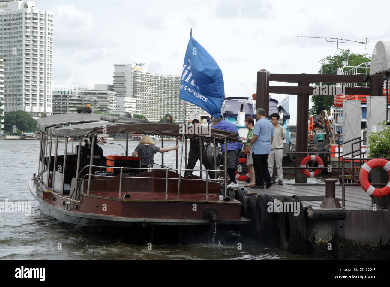 Travelers using Millenium Hilton Hotel Ferry Boat in Bangkok Stock ...