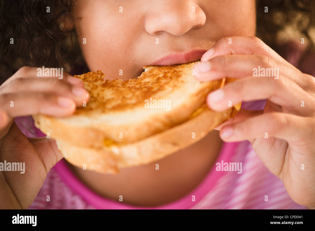 African girl eating sandwich hi-res stock photography and images - Alamy