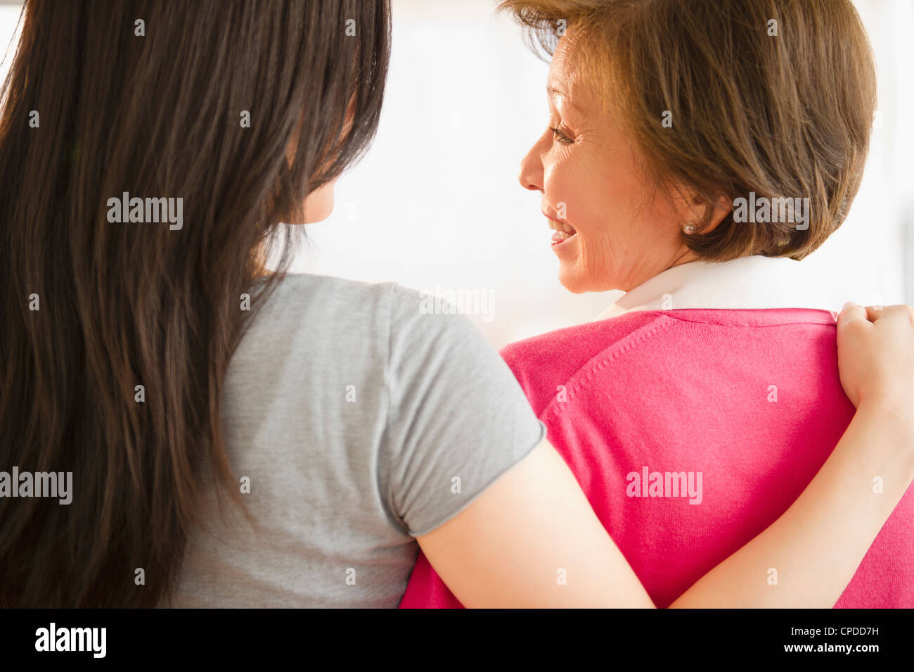 Japanese daughter hugging mother Stock Photo - Alamy