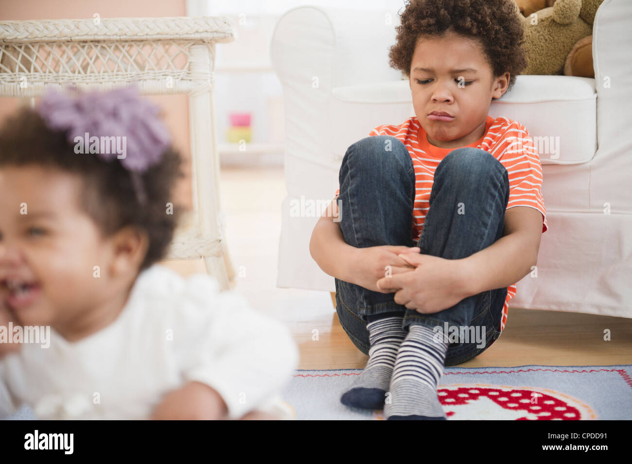 Baby unhappy with sibling hi-res stock photography and images - Alamy
