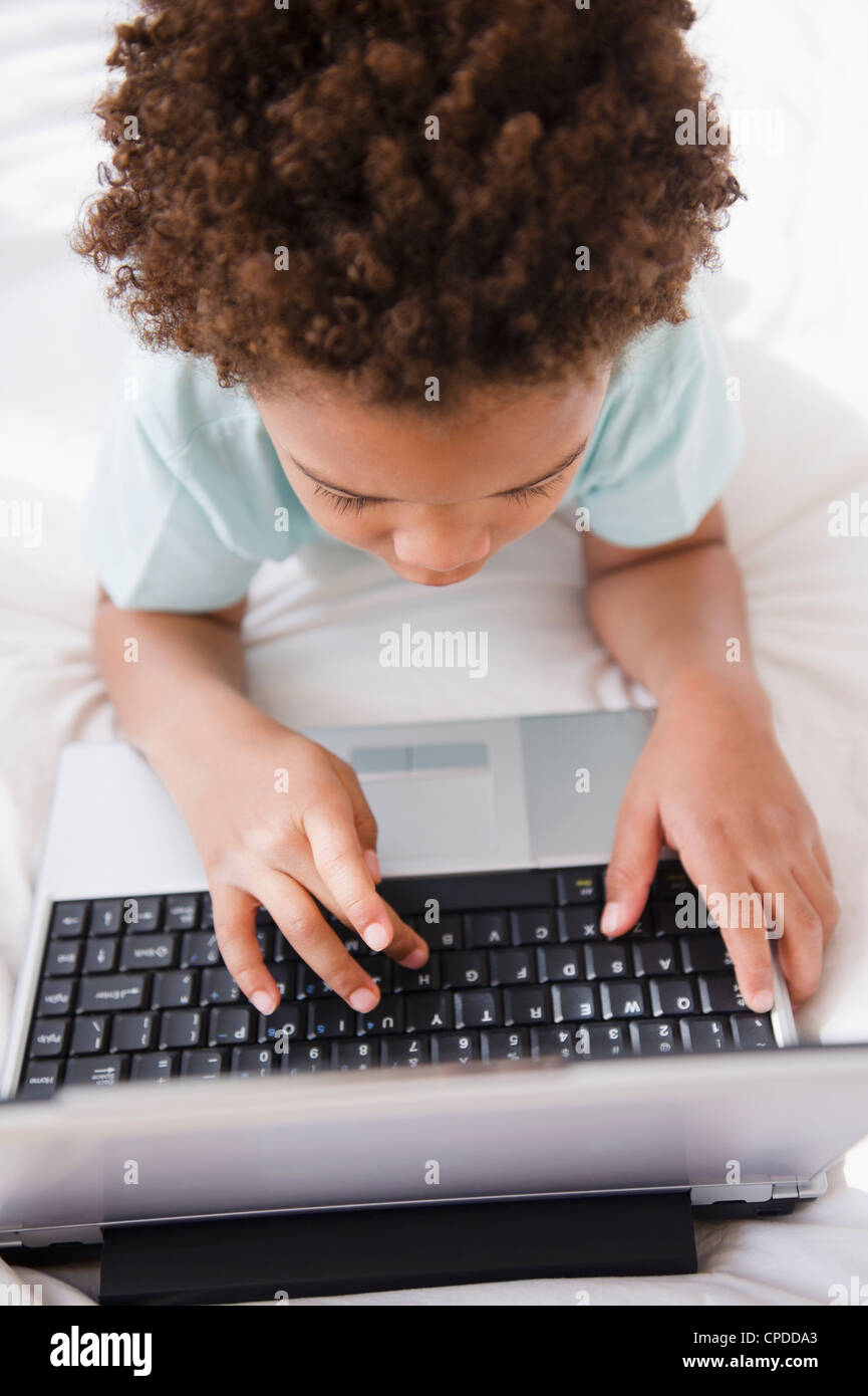 Black boy typing on computer Stock Photo - Alamy