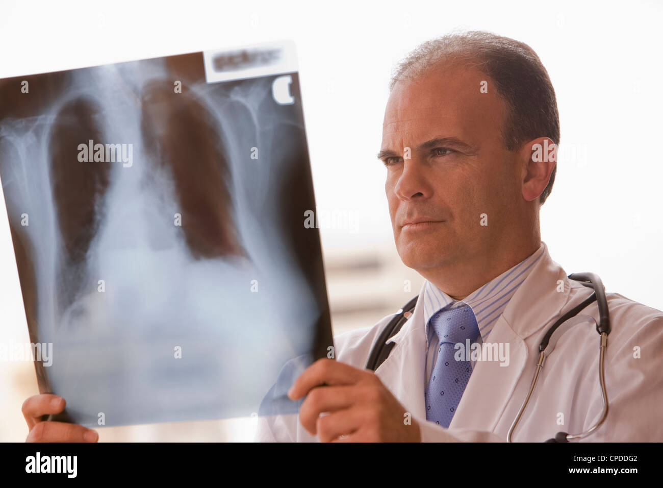 Doctor reviewing x rays hi-res stock photography and images - Alamy