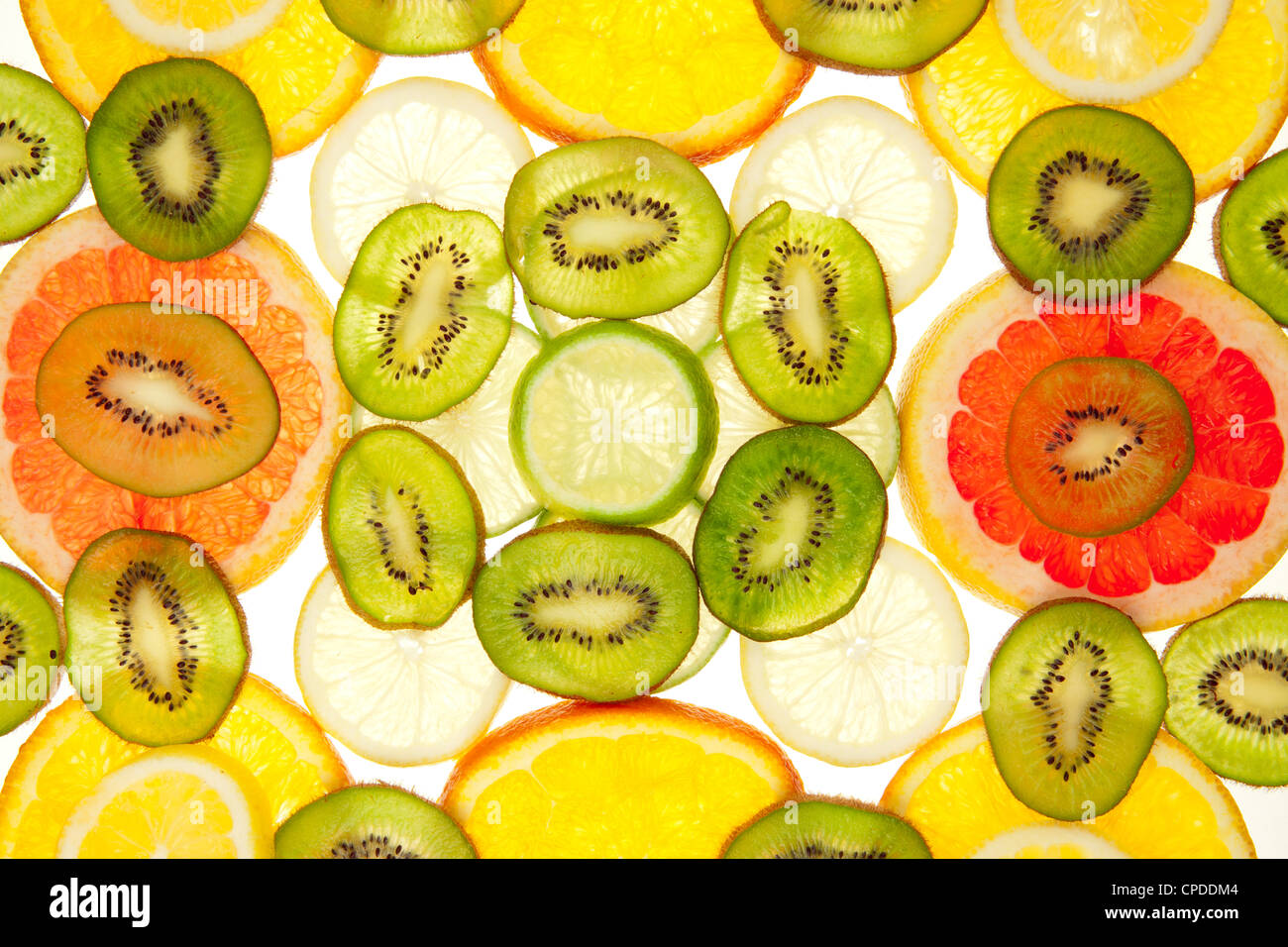 Colorful background of different fruit slices Stock Photo - Alamy