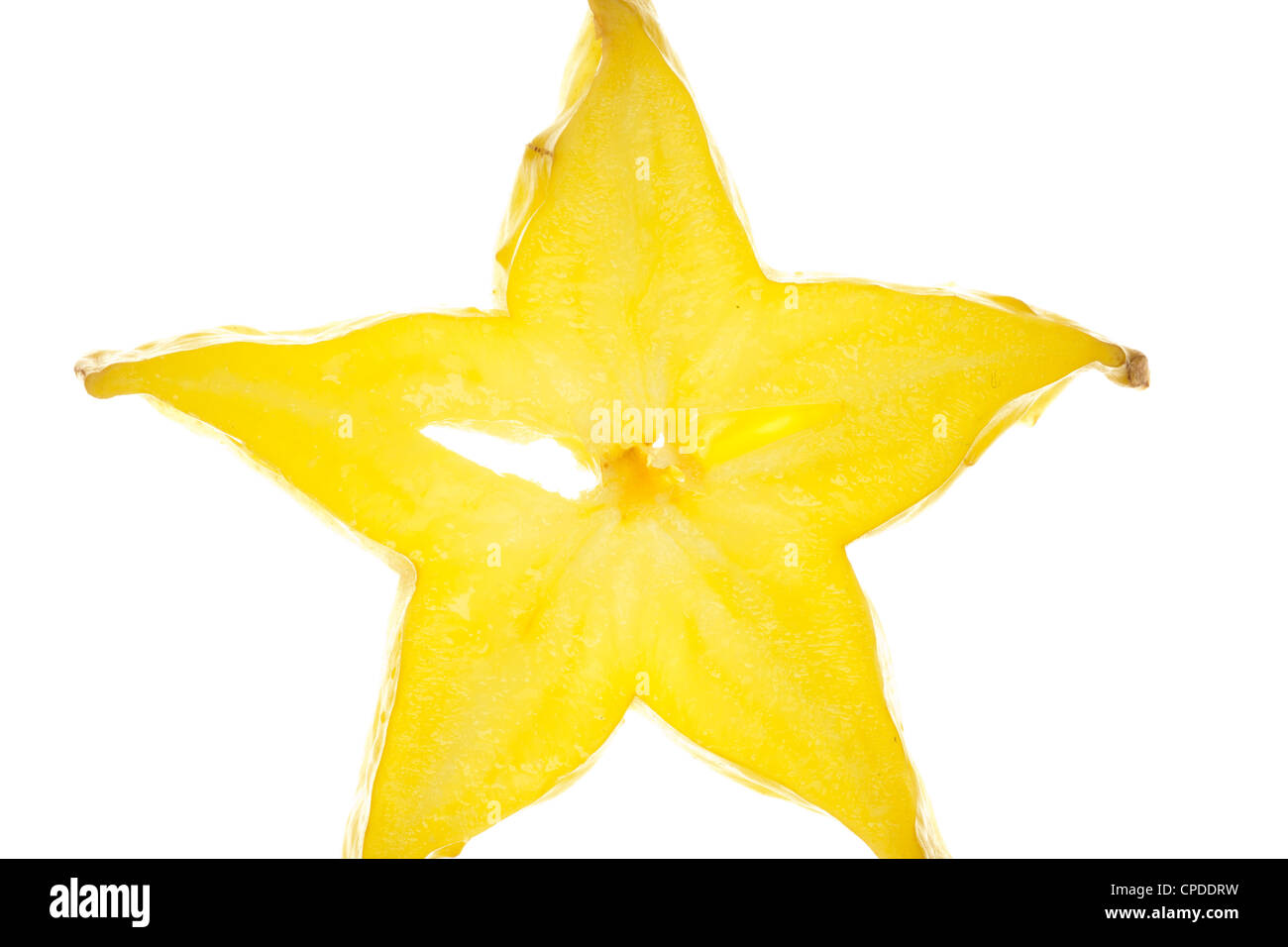 Macro shot of a star fruit slice on white background Stock Photo - Alamy