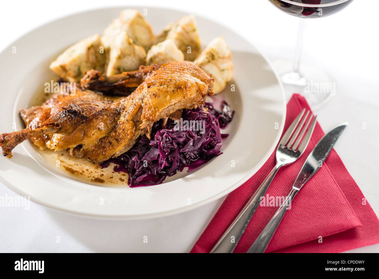 Roasted duck with red cabbage and dumpling isolated on white Stock ...