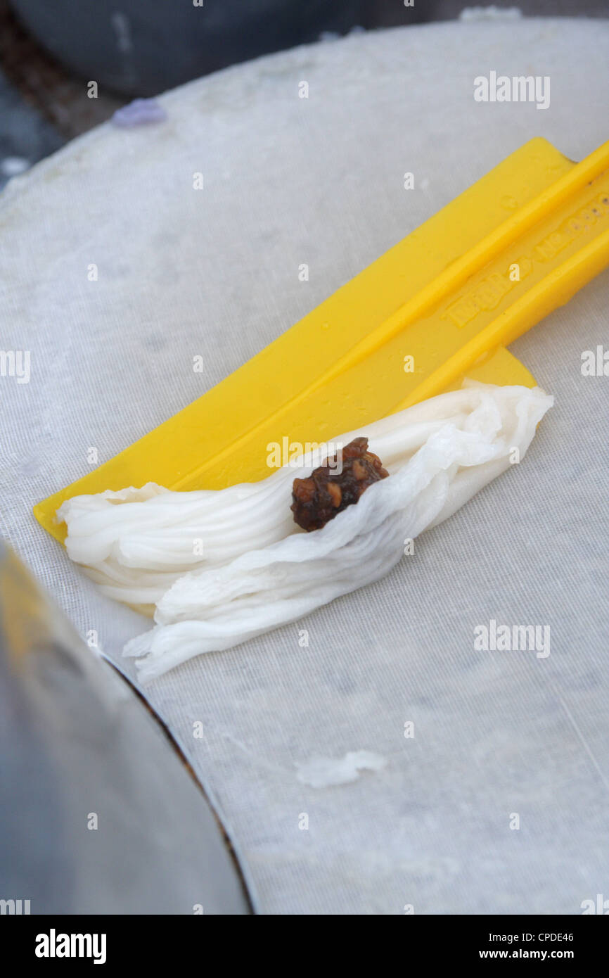 Thai merchant cooking Thai appetizer , KHAO KREAB PAK MOR Stock Photo ...