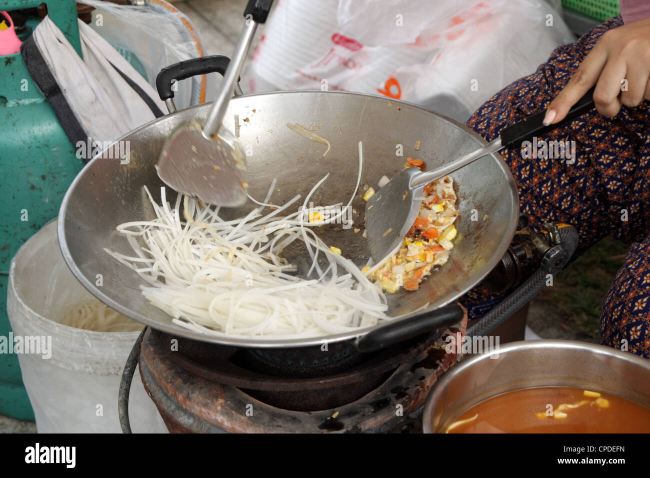 Thai woman cooking Pad Thai , traditional thai noodle dish Stock Photo ...