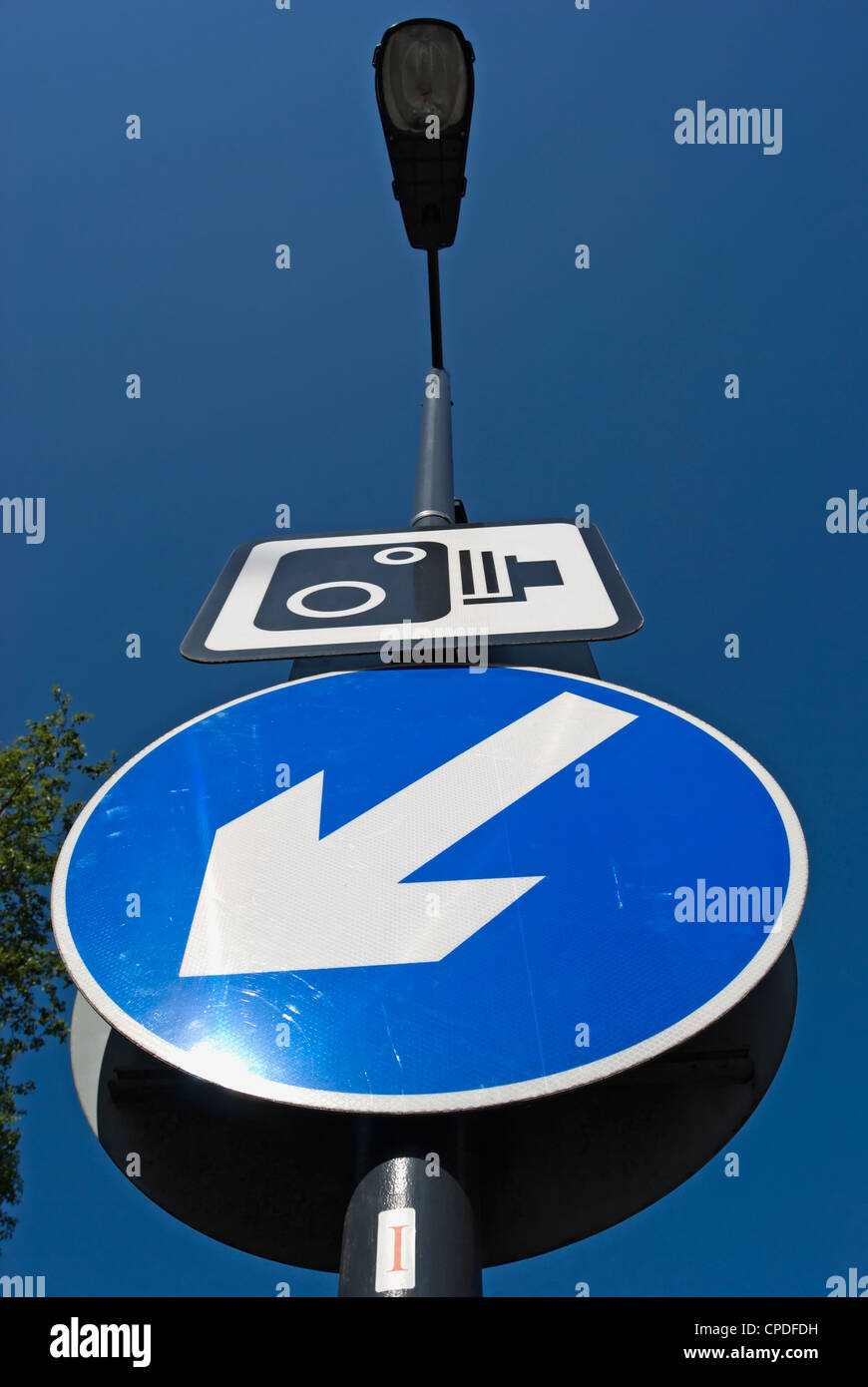 british road sign indicating traffic should keep to the left, below ...