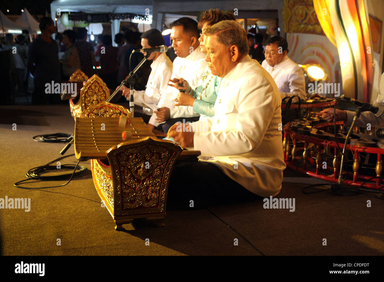 Thai musician performing a Ranat Ek (traditional Thai xylophone) on ...
