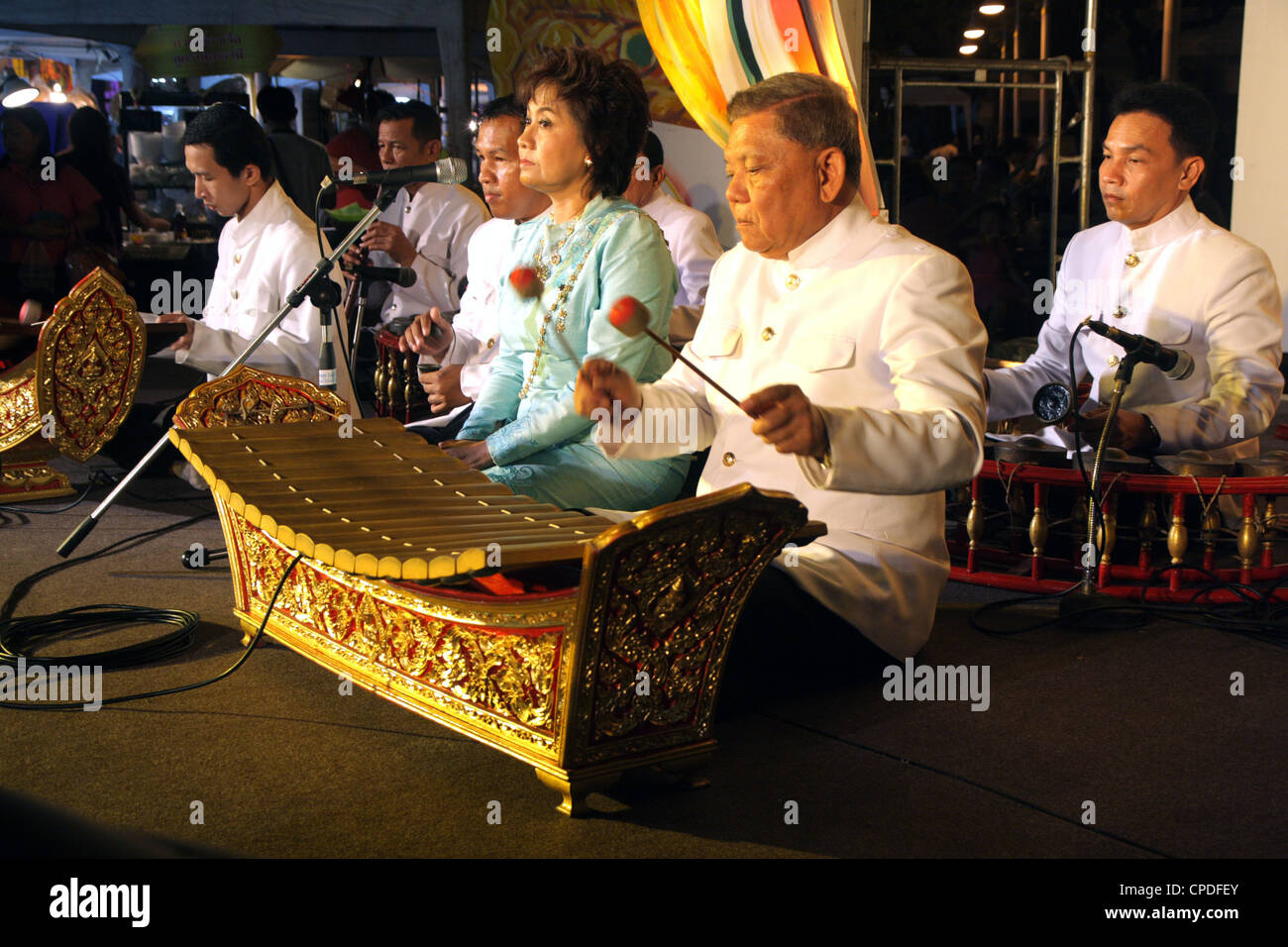 Thai musician performing a Ranat Ek (traditional Thai xylophone) on ...