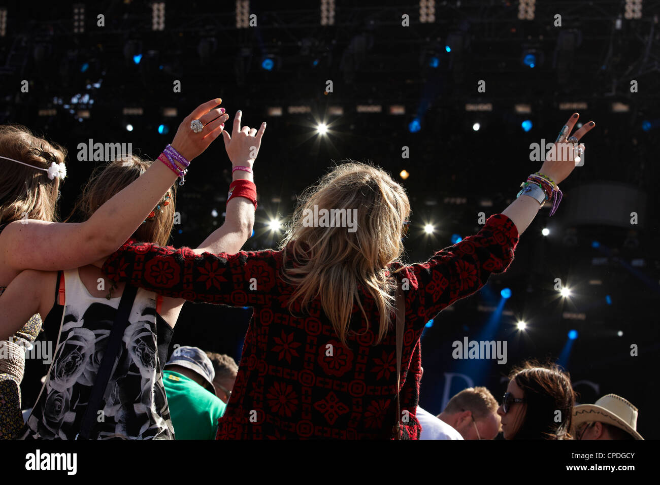 Girls cheering hysterically at a gig at a music festival Stock Photo ...