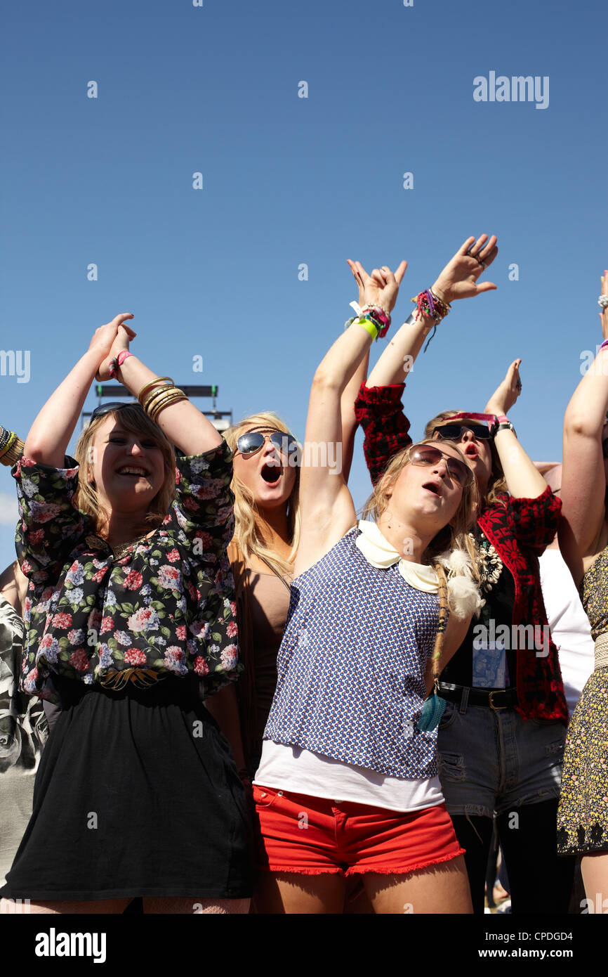 Girls cheering hysterically at a gig at a music festival Stock Photo ...