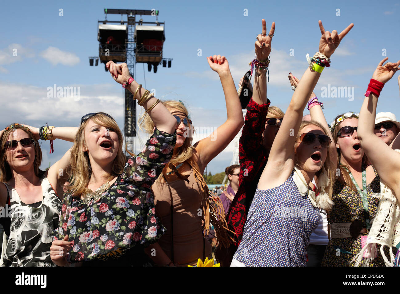Girls cheering hysterically at a gig at a music festival Stock Photo ...