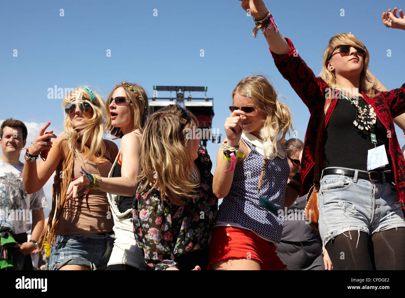 Girls cheering hysterically at a gig at a music festival Stock Photo ...