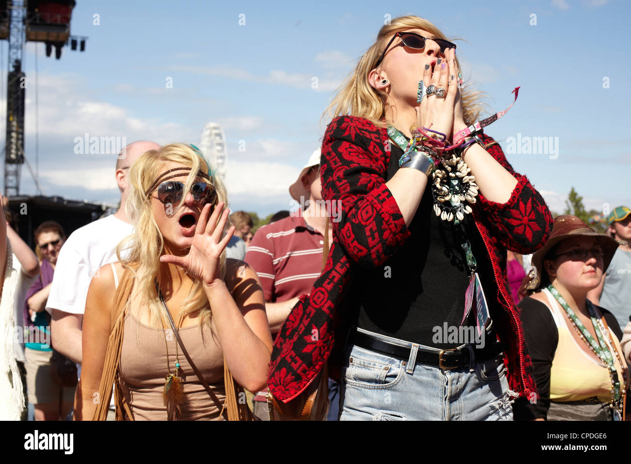 Girls cheering hysterically at a gig at a music festival Stock Photo ...