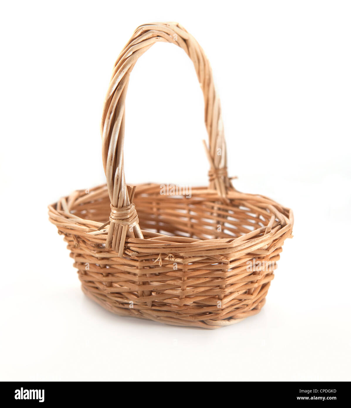 Brown wicker basket on the white background Stock Photo - Alamy