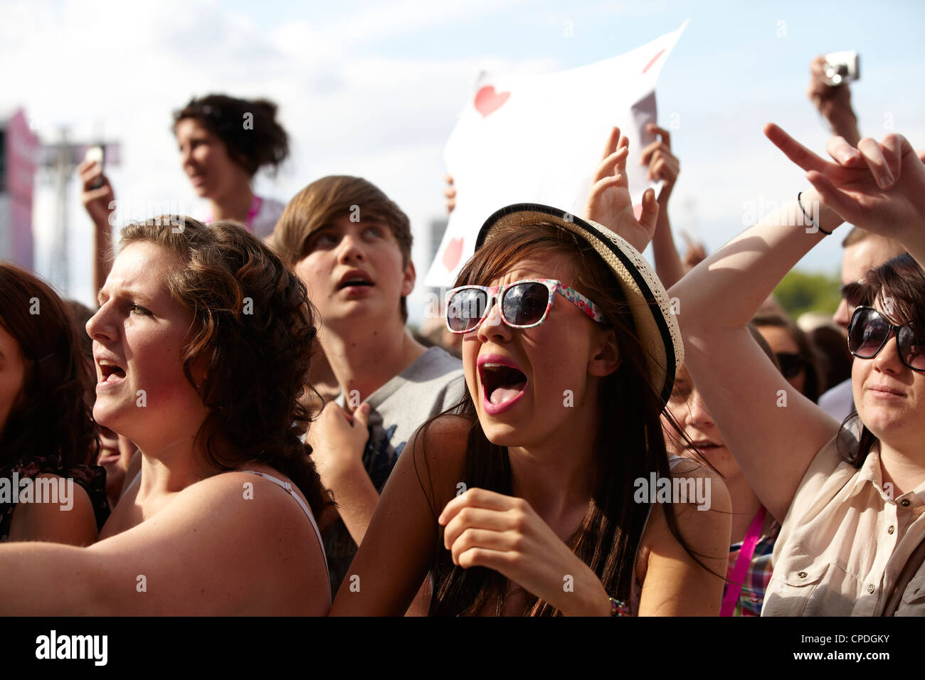 Crowd cheering in front row at a music festival Stock Photo - Alamy