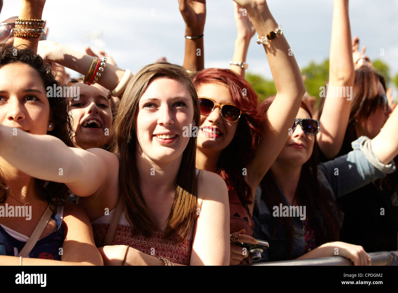 Crowd cheering in front row at a music festival Stock Photo - Alamy