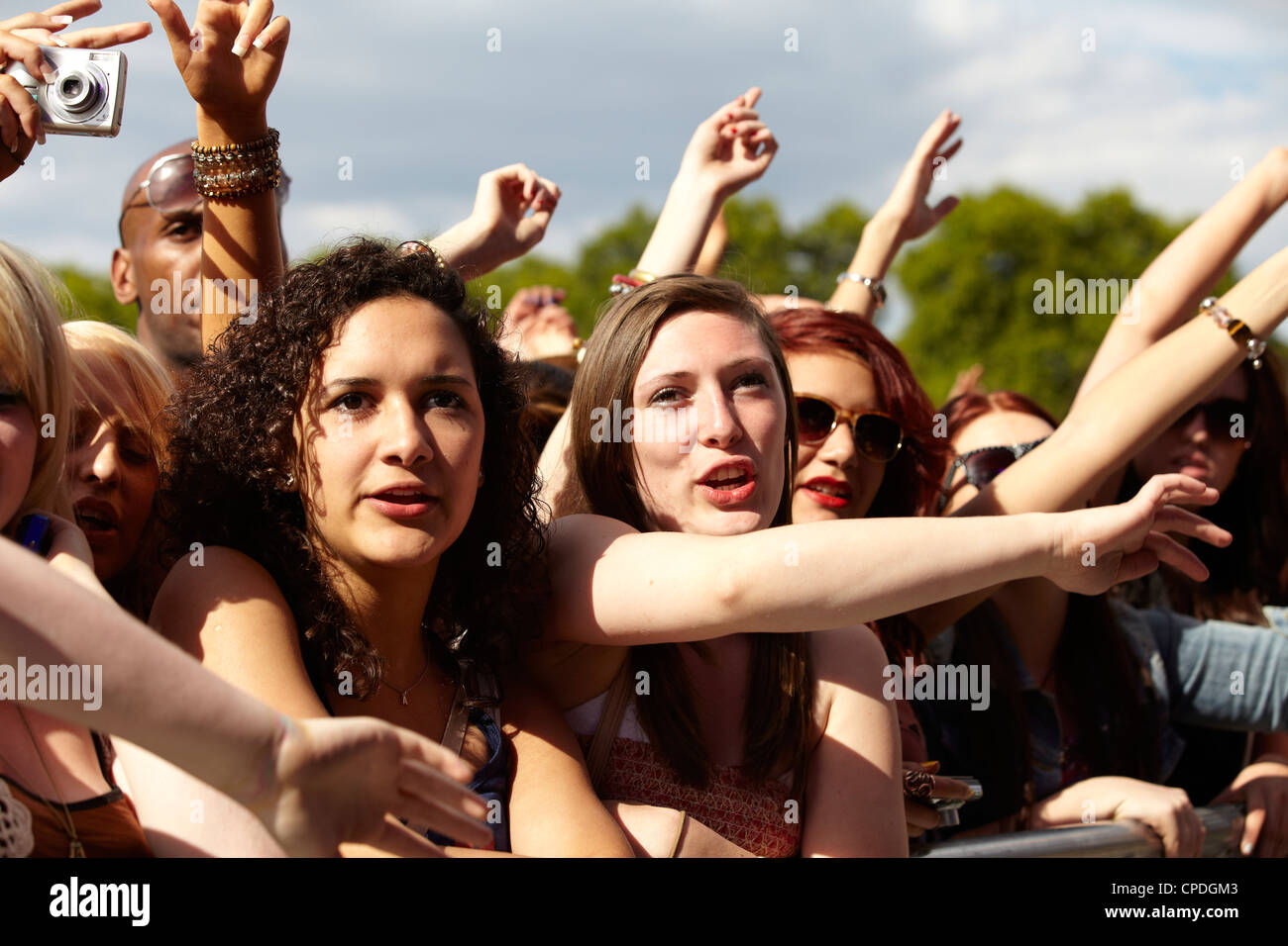 Crowd cheering in front row at a music festival Stock Photo - Alamy