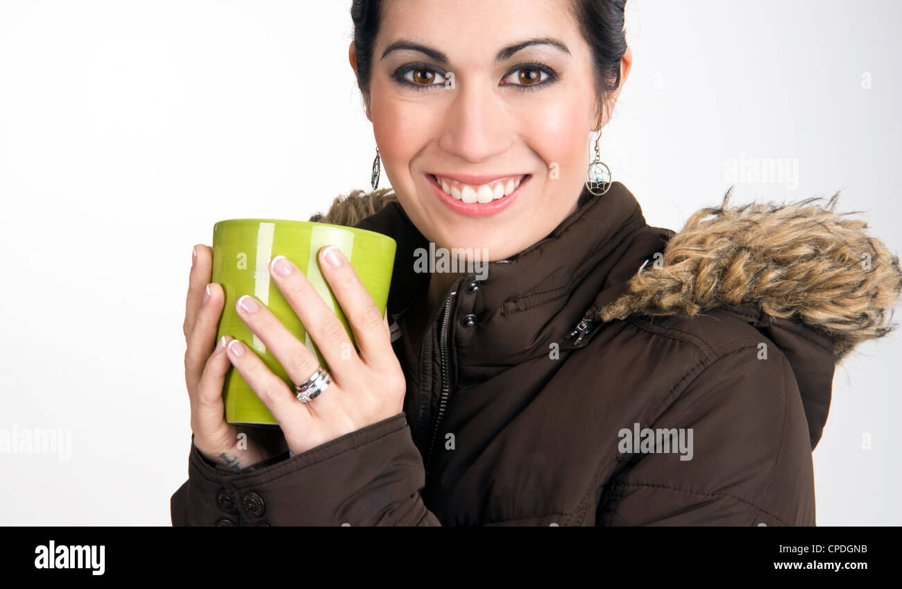 A beautiful woman warms up with a mug of Java Stock Photo - Alamy