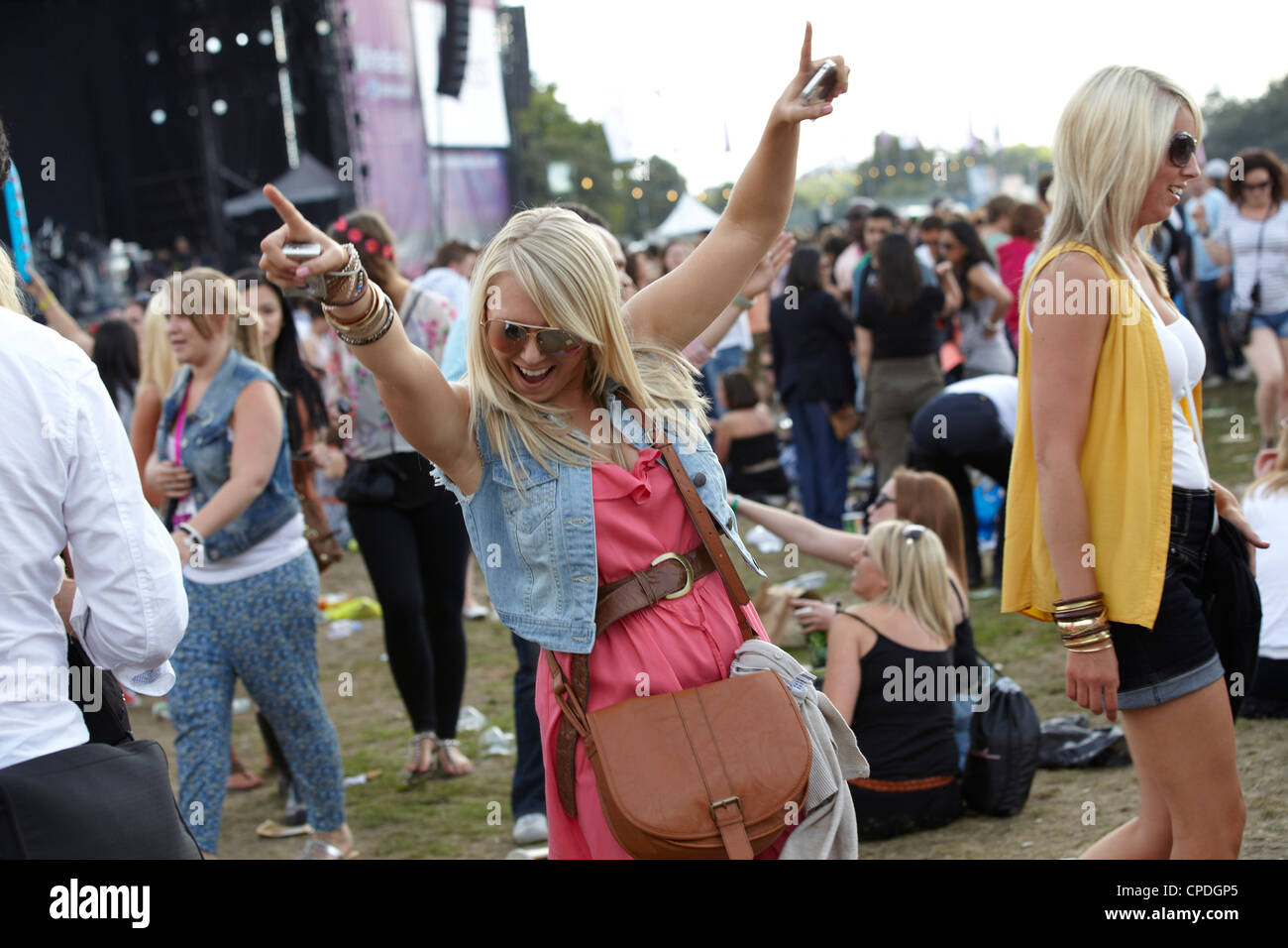 Girl dancing and laughing at a music festival Stock Photo - Alamy