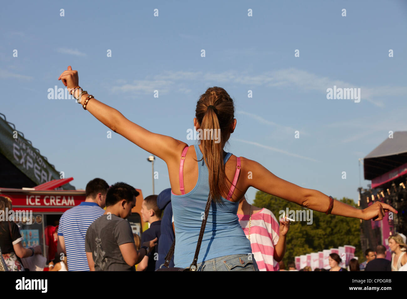 Girl dancing at a summer music festival Stock Photo - Alamy