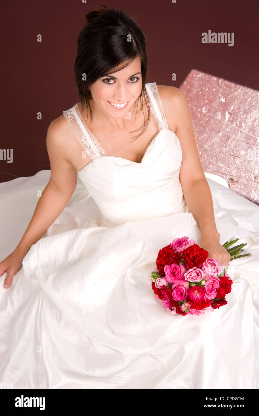 Bride Seated with Bouquet Stock Photo - Alamy