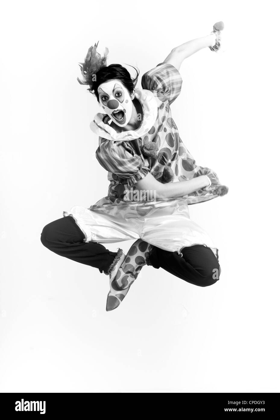 Woman jumps into the air a clown performer Stock Photo - Alamy