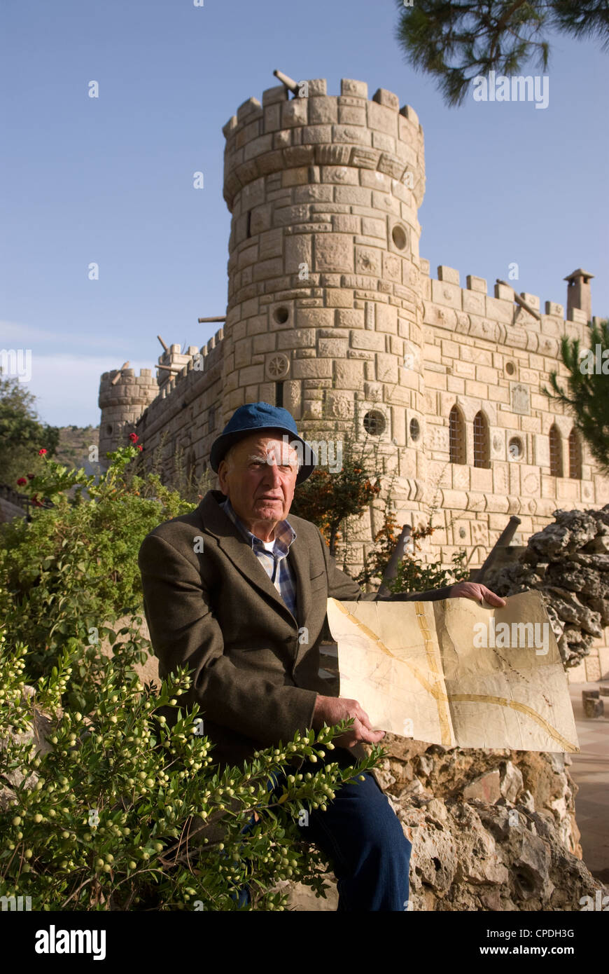 Mr Moussa with his original childhood plans for his dream castle ...