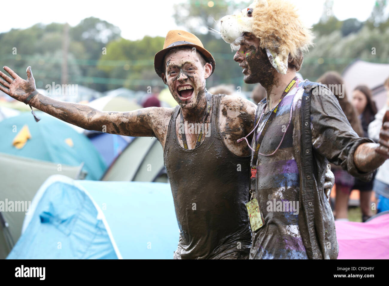 Boys playing in mud at music festival in the UK Stock Photo - Alamy