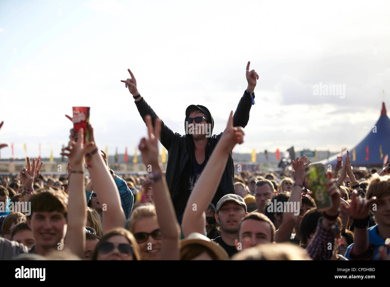 Boy at music festival cheering in a crowd on shoulders Stock Photo - Alamy