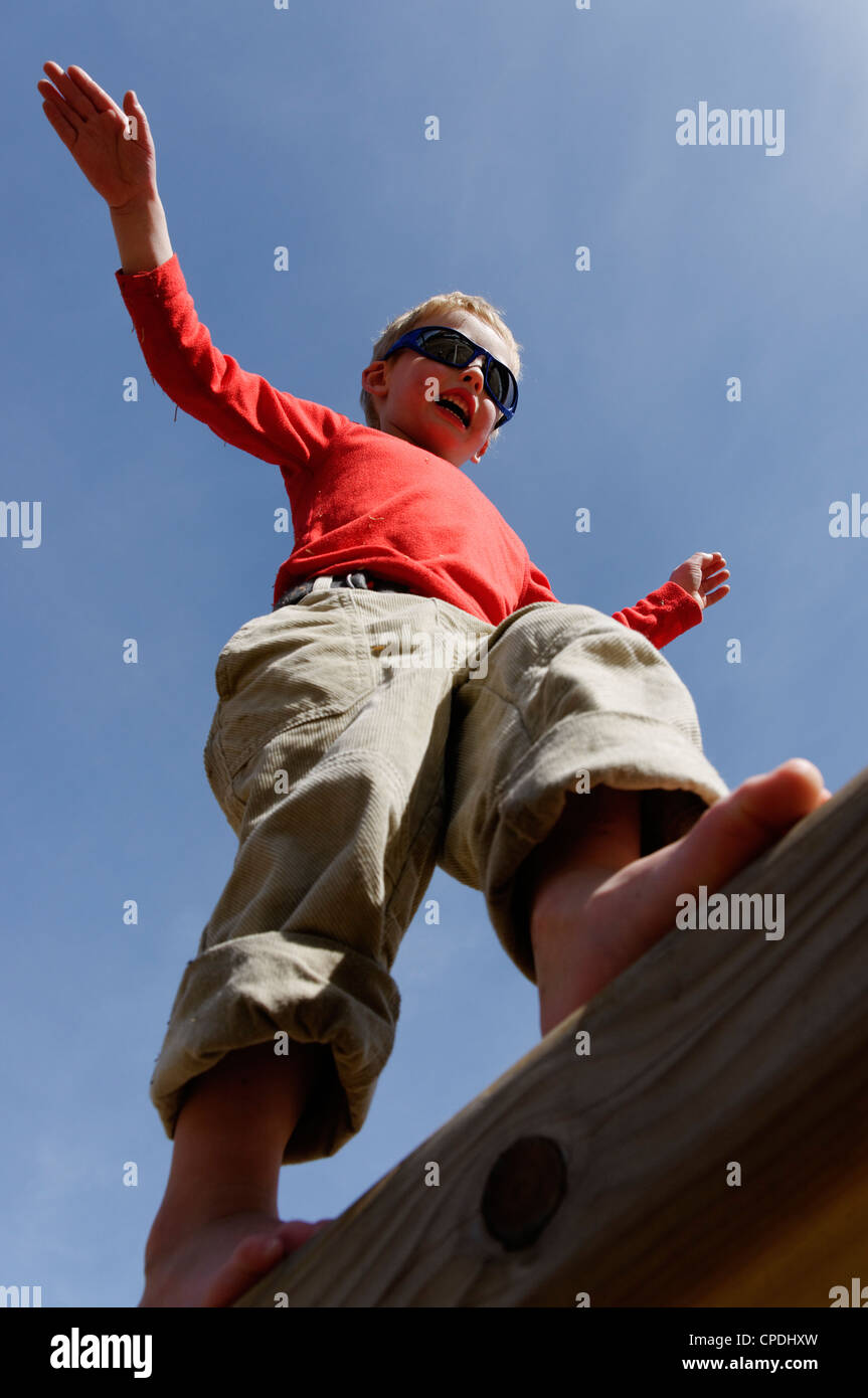 A young boy on a balance beam Stock Photo - Alamy