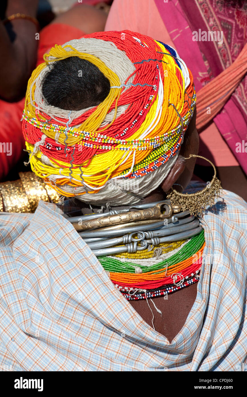 Head of Bonda tribeswoman wearing traditional beaded cap, Rayagader ...