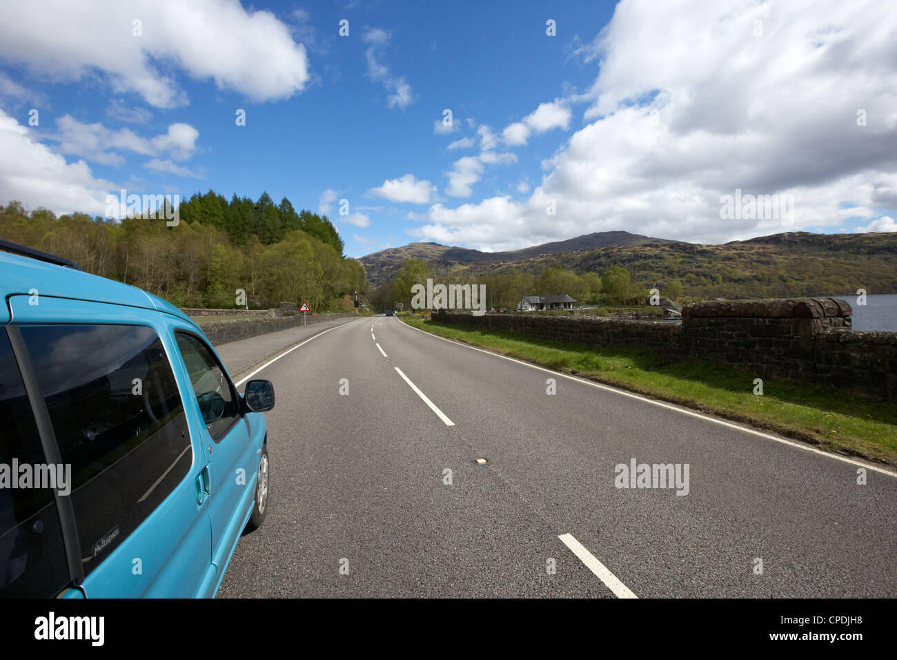 car driving along the a82 past west loch lomond on the old military ...