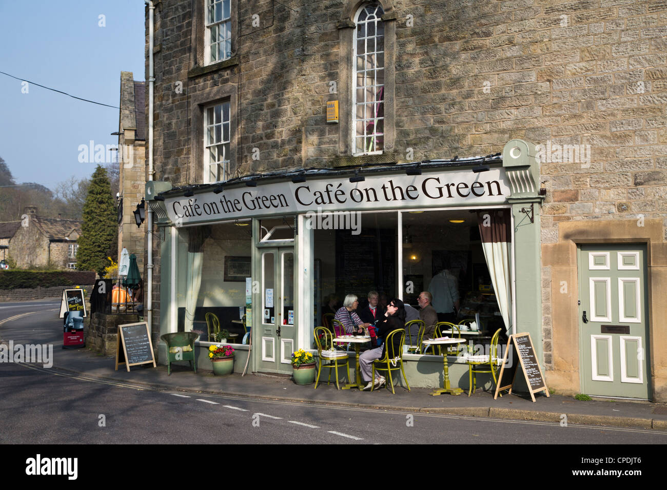 people sitting in café in the Derbyshire village of Baslow in the Peak ...