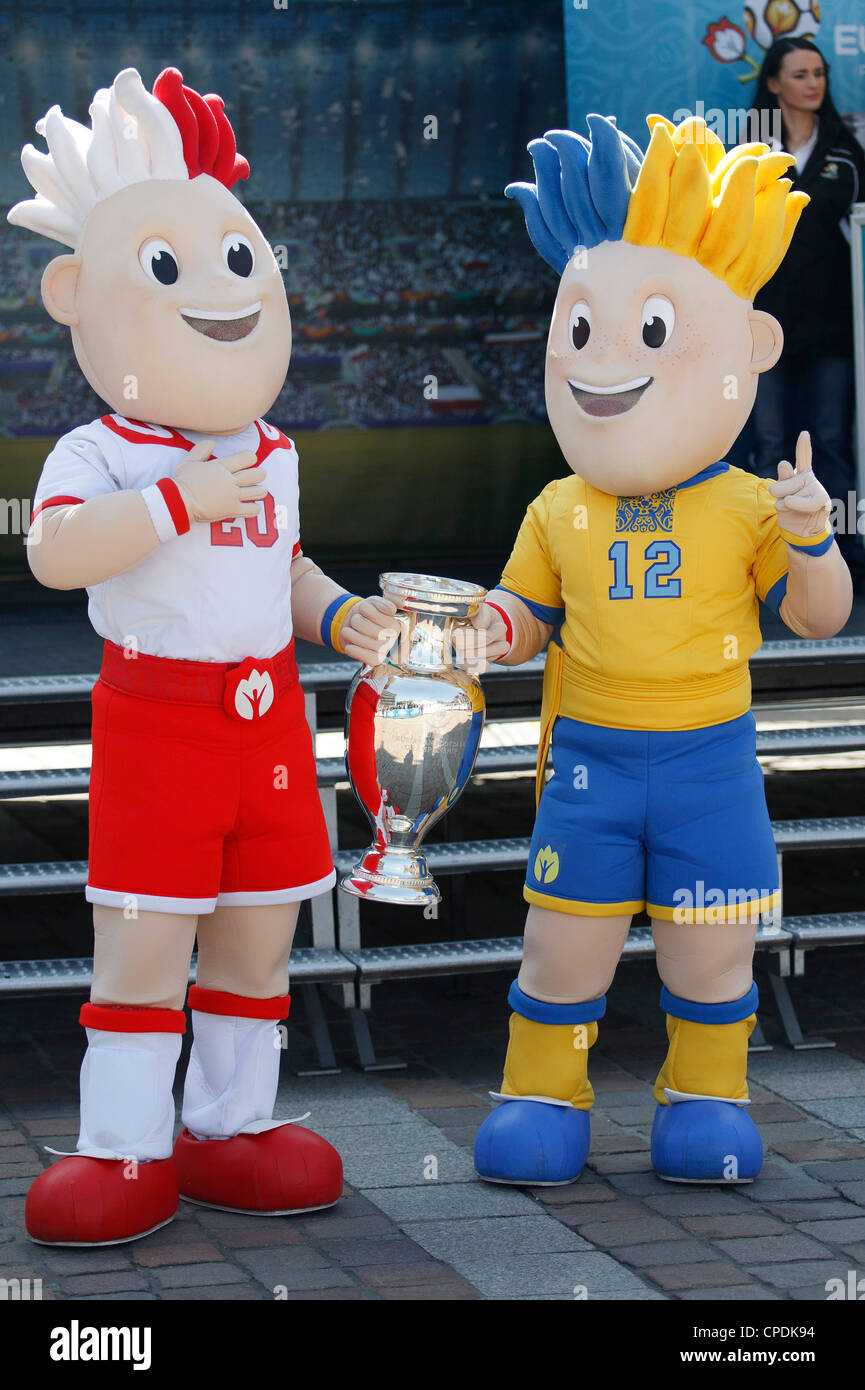 Mascots Slavek and Slavko hold trophy of EURO 2012 in Krakow, Poland ...