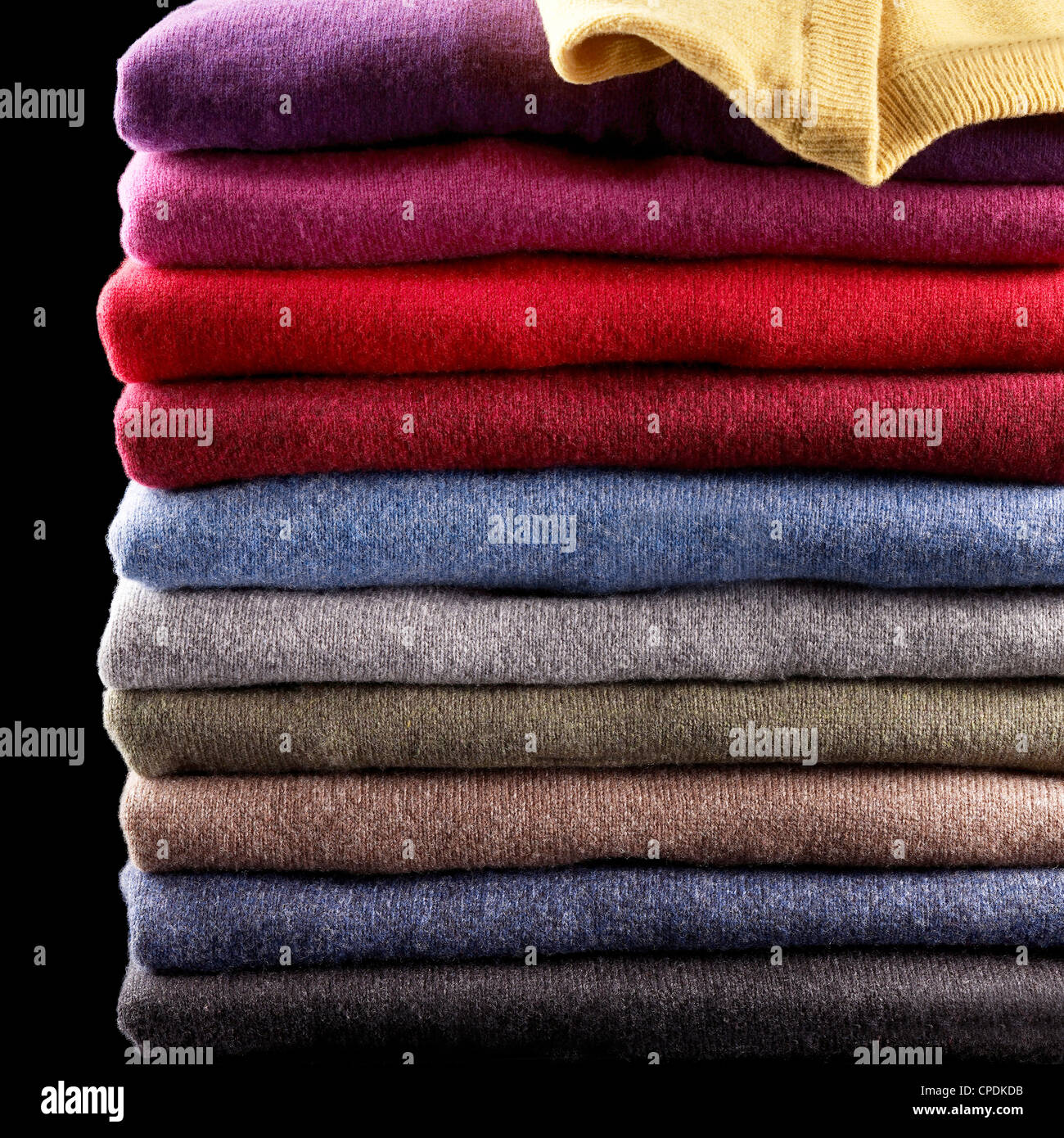 stack of v neck sweater/jumpers Stock Photo - Alamy