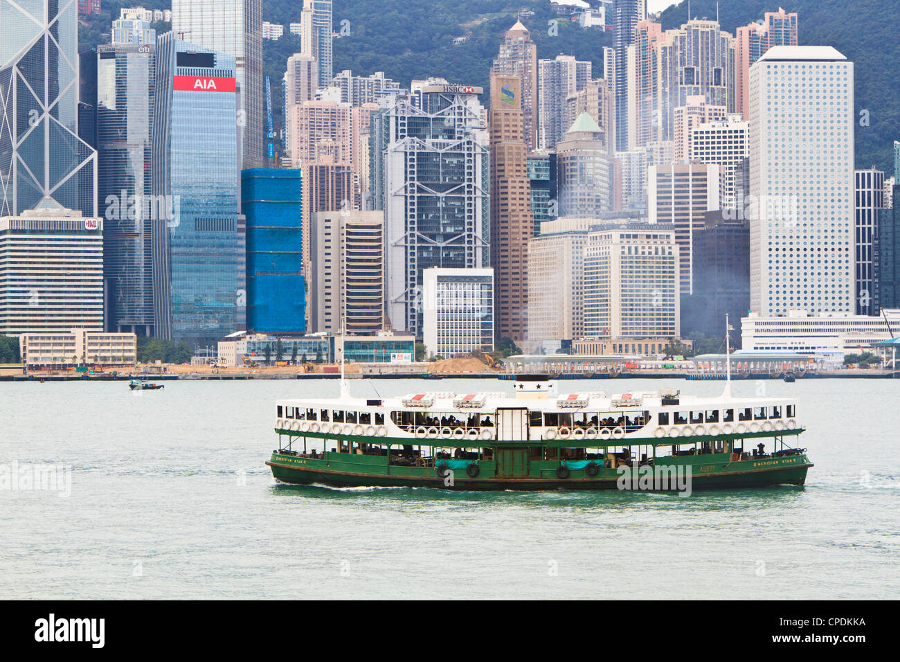 Star ferry crosses Victoria Harbour with Hong Kong Island skyline ...